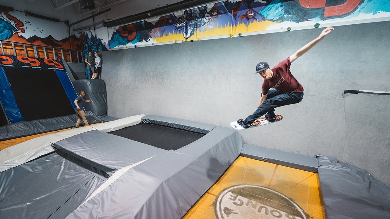 How To Tweak & Bone Your Tricks On A Tramp Board – Snowboard Addiction